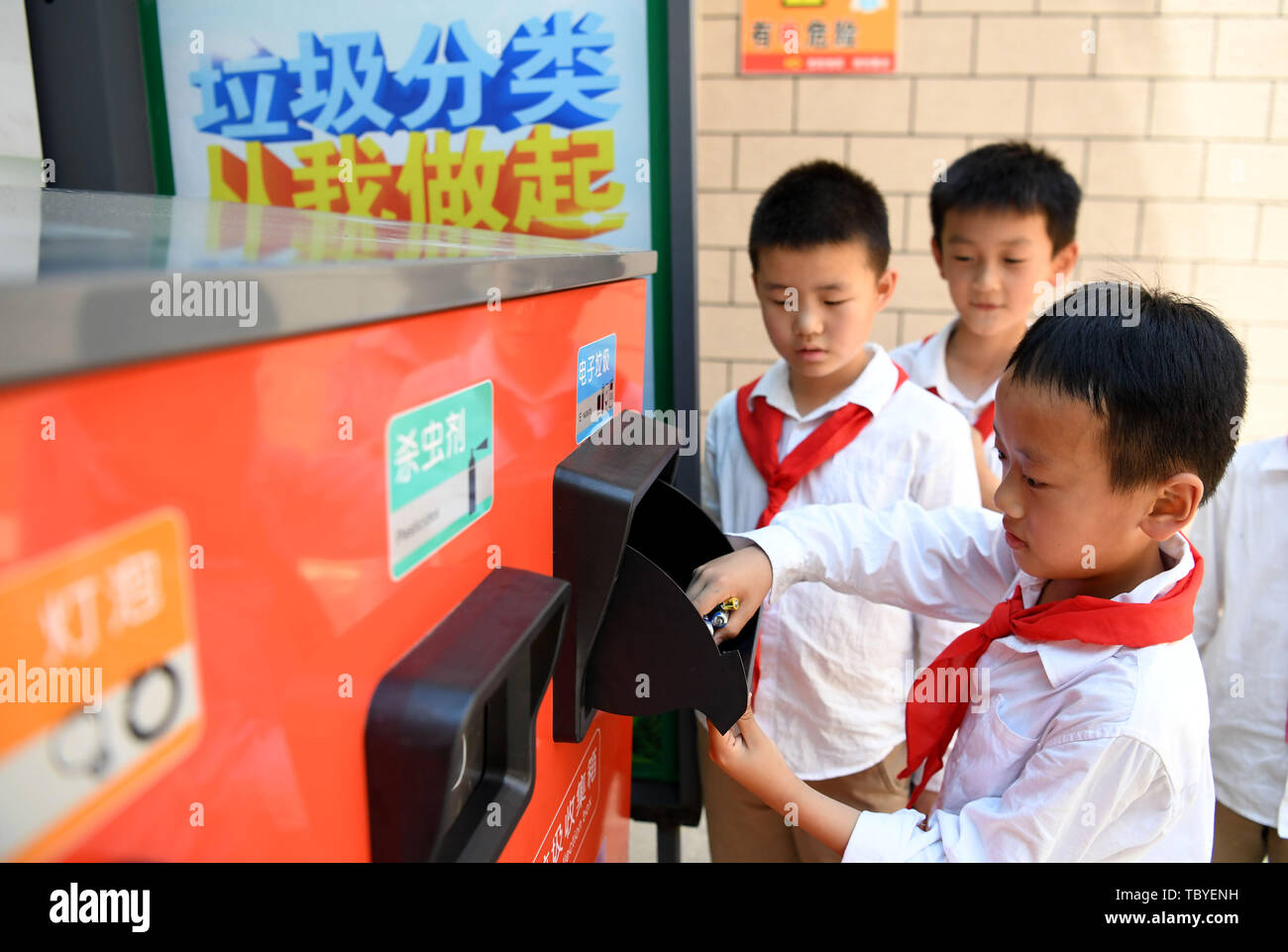 Hefei, China's Anhui Province. 4th June, 2019. A pupil throws waste ...