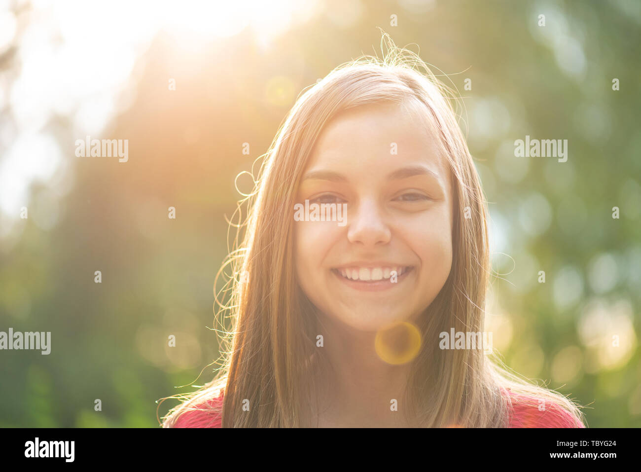Portrait of teen girl with sun rays Stock Photo - Alamy