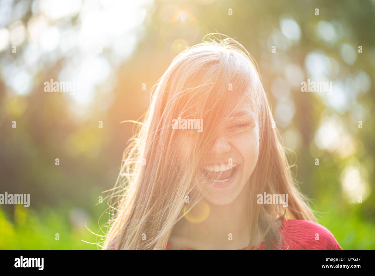 Portrait of teen girl with sun rays Stock Photo - Alamy