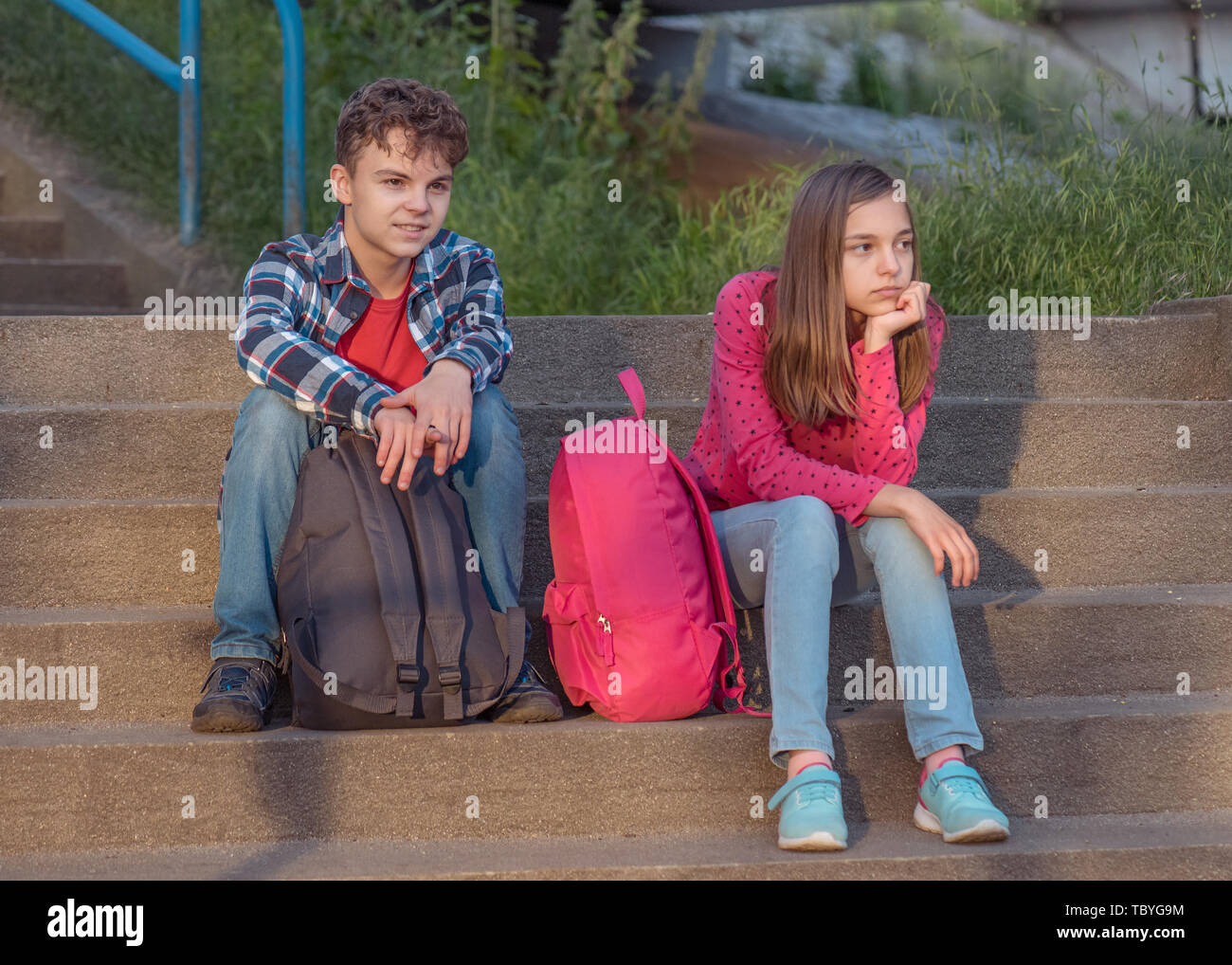 Boy girl sitting stairs hi-res stock photography and images - Alamy
