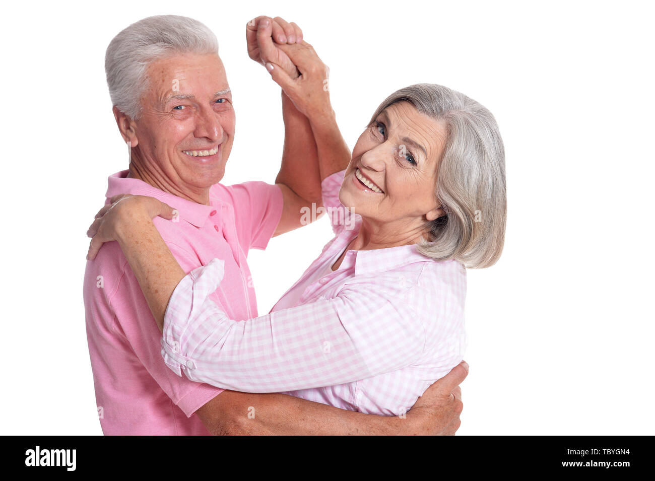 Portrait of senior couple dancing isolated on white background Stock ...
