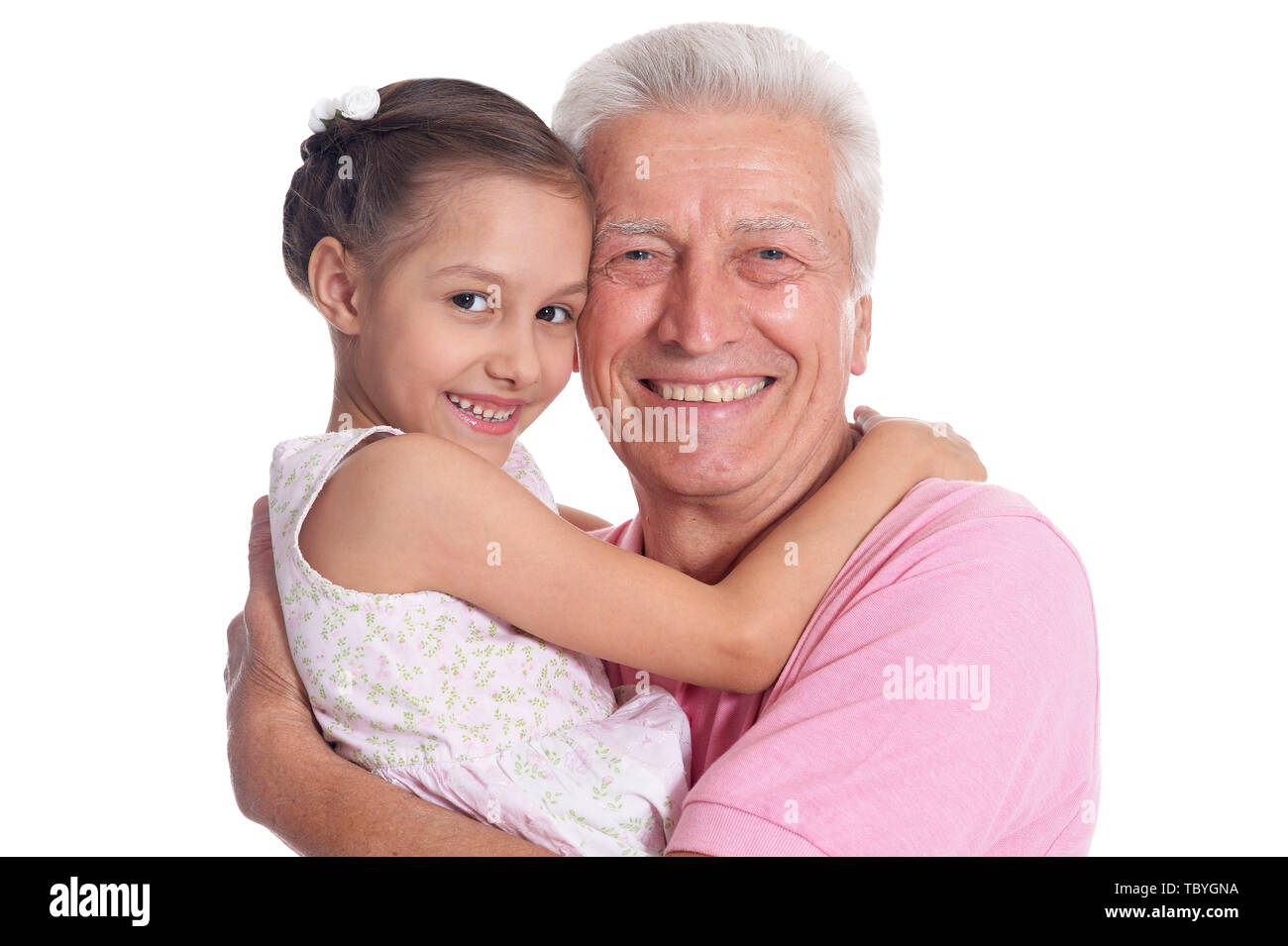 Happy elderly man with cute granddaughter isolated on white background ...