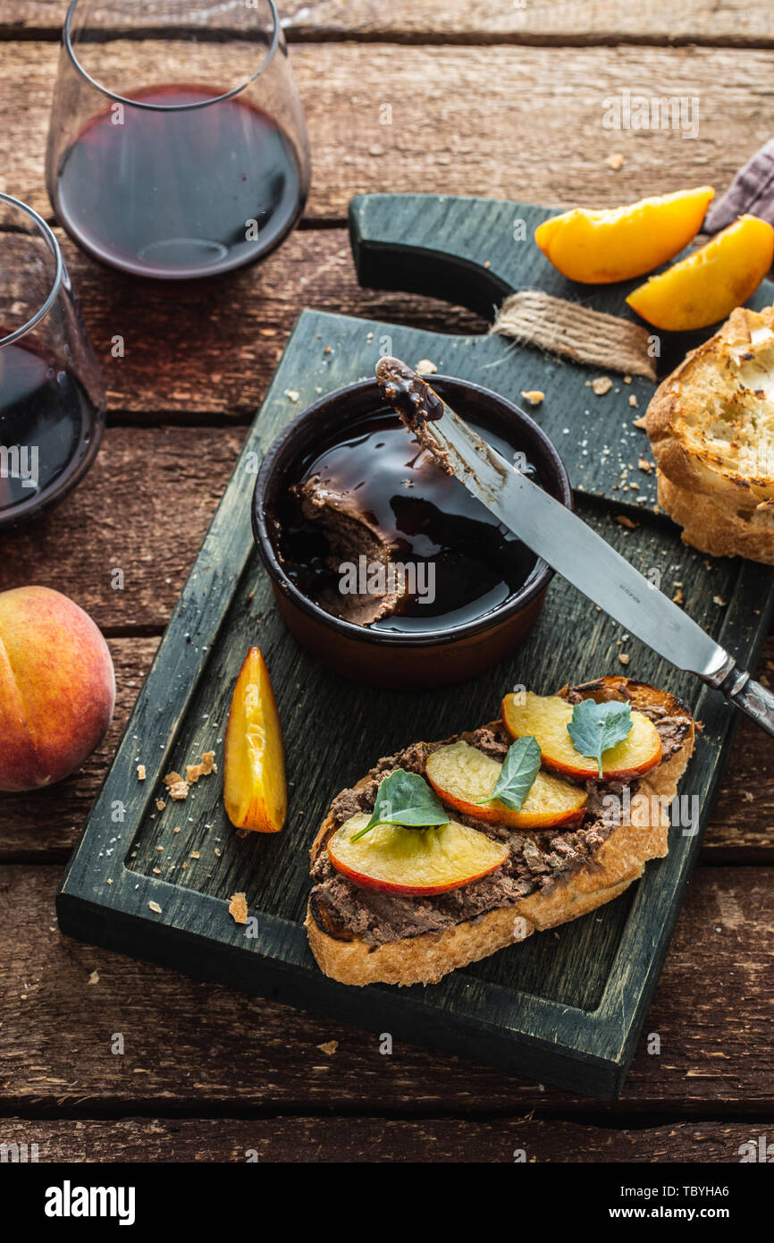 Bread with liver pate and peach slices Stock Photo - Alamy