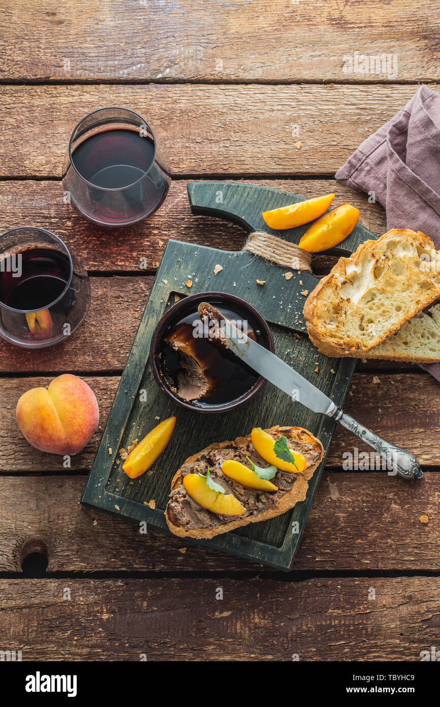 Chicken liver pate with griiled bread and peach, rustic style Stock ...