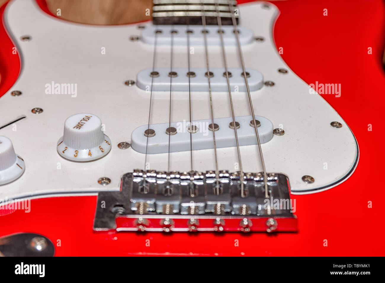 Electric guitar in red and white Stock Photo - Alamy