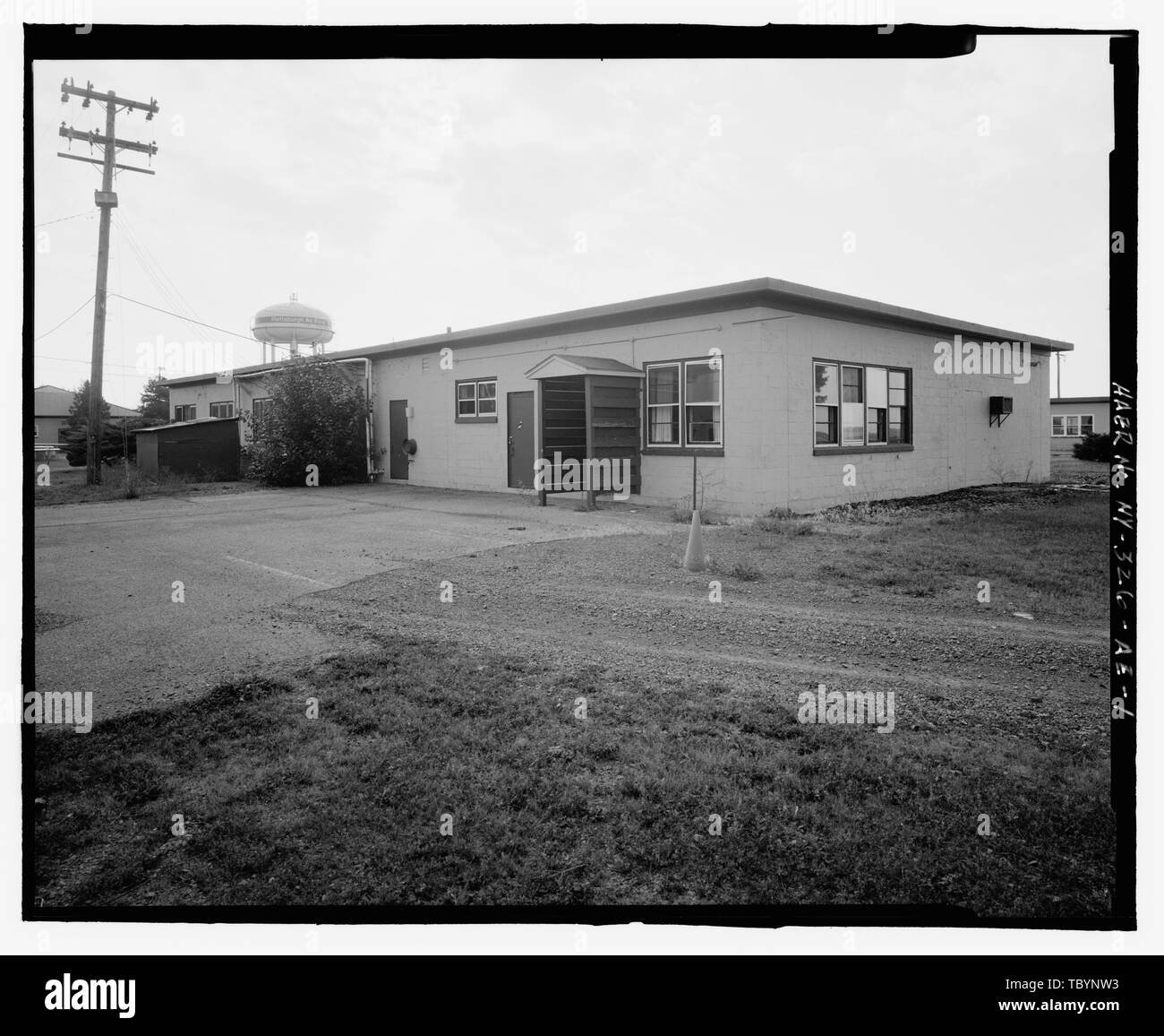 NORTH (FRONT) AND WEST (SIDE) ELEVATIONS OF BUILDING. VIEW TO EAST ...