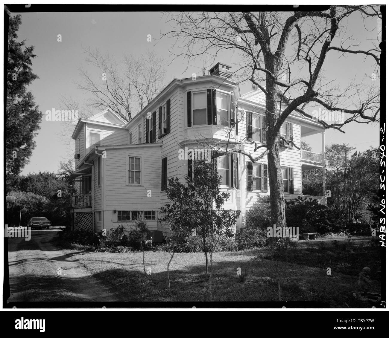 NORTH (REAR) ELEVATION (left) AND WEST SIDE. North wings and bay window ...