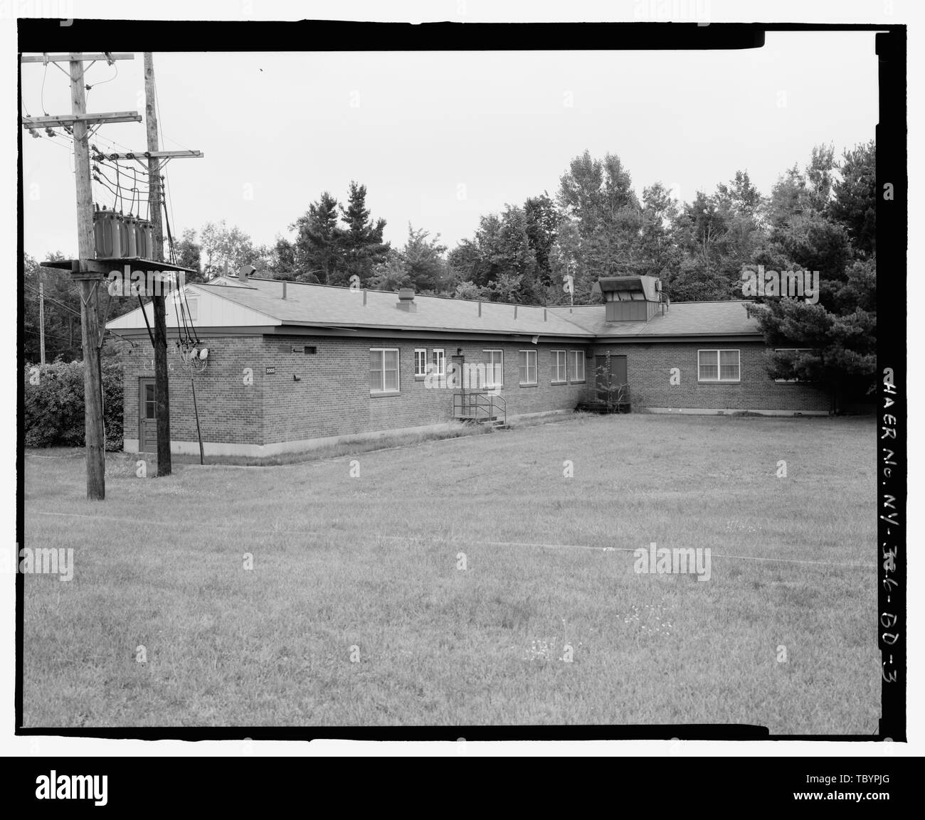 NORTH (SIDE) AND WEST (REAR) ELEVATIONS OF BUILDING. view TO SOUTHEAST ...