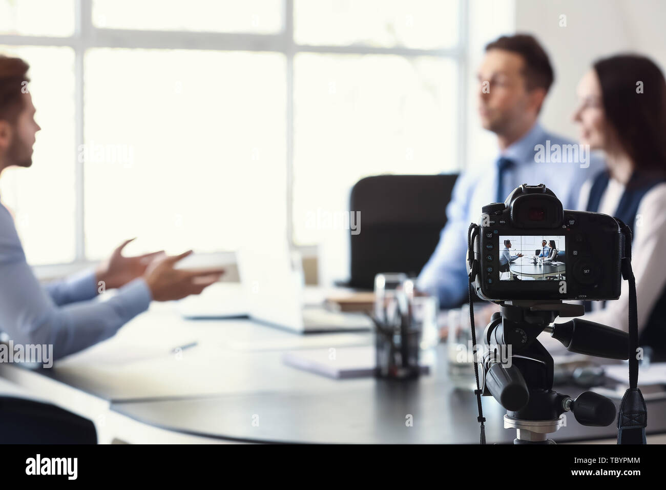 Filming of job interview with applicant in office Stock Photo - Alamy