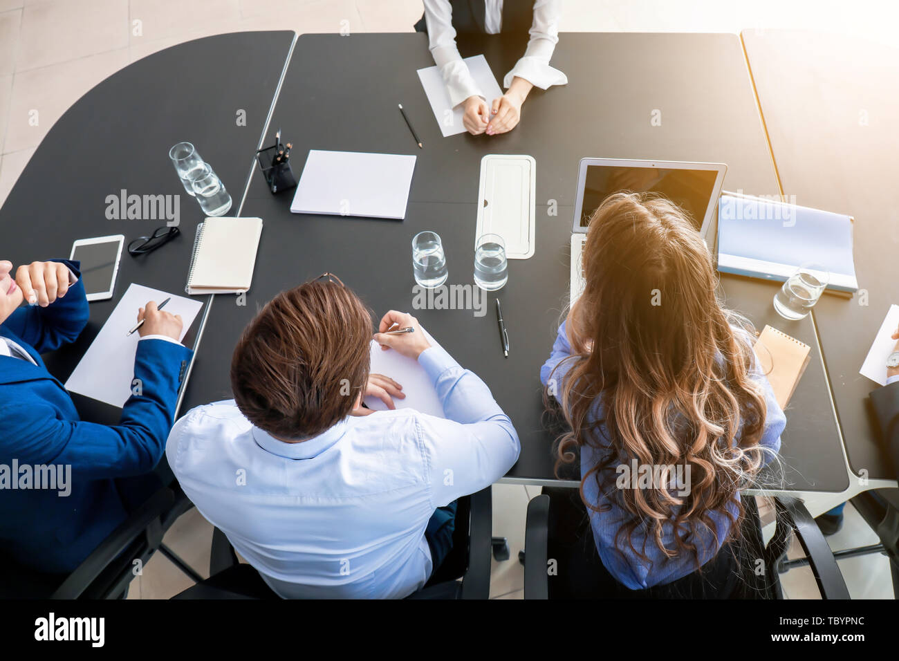 Human resources commission interviewing woman in office Stock Photo - Alamy