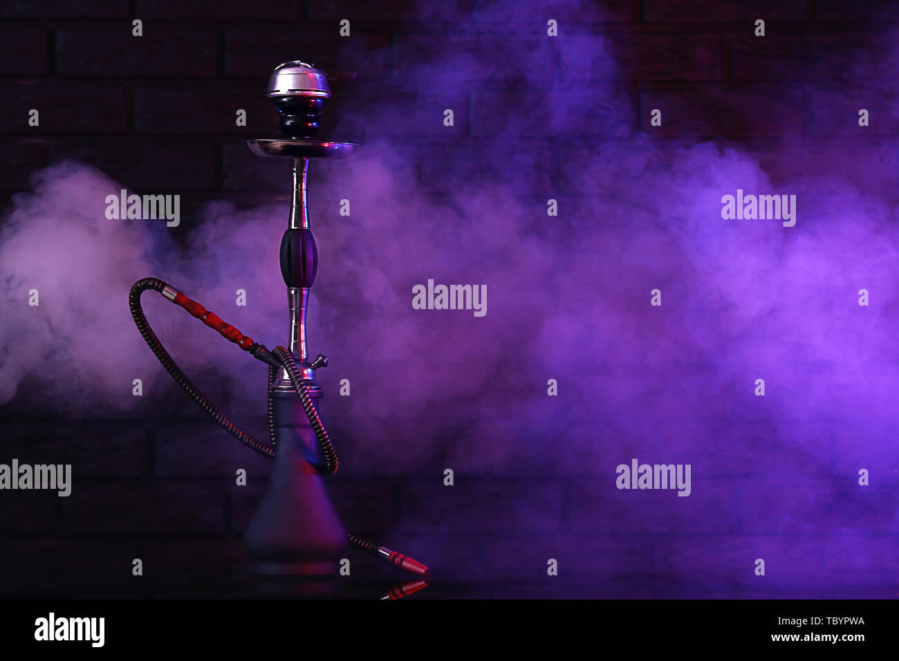 Hookah with fume on dark background Stock Photo - Alamy