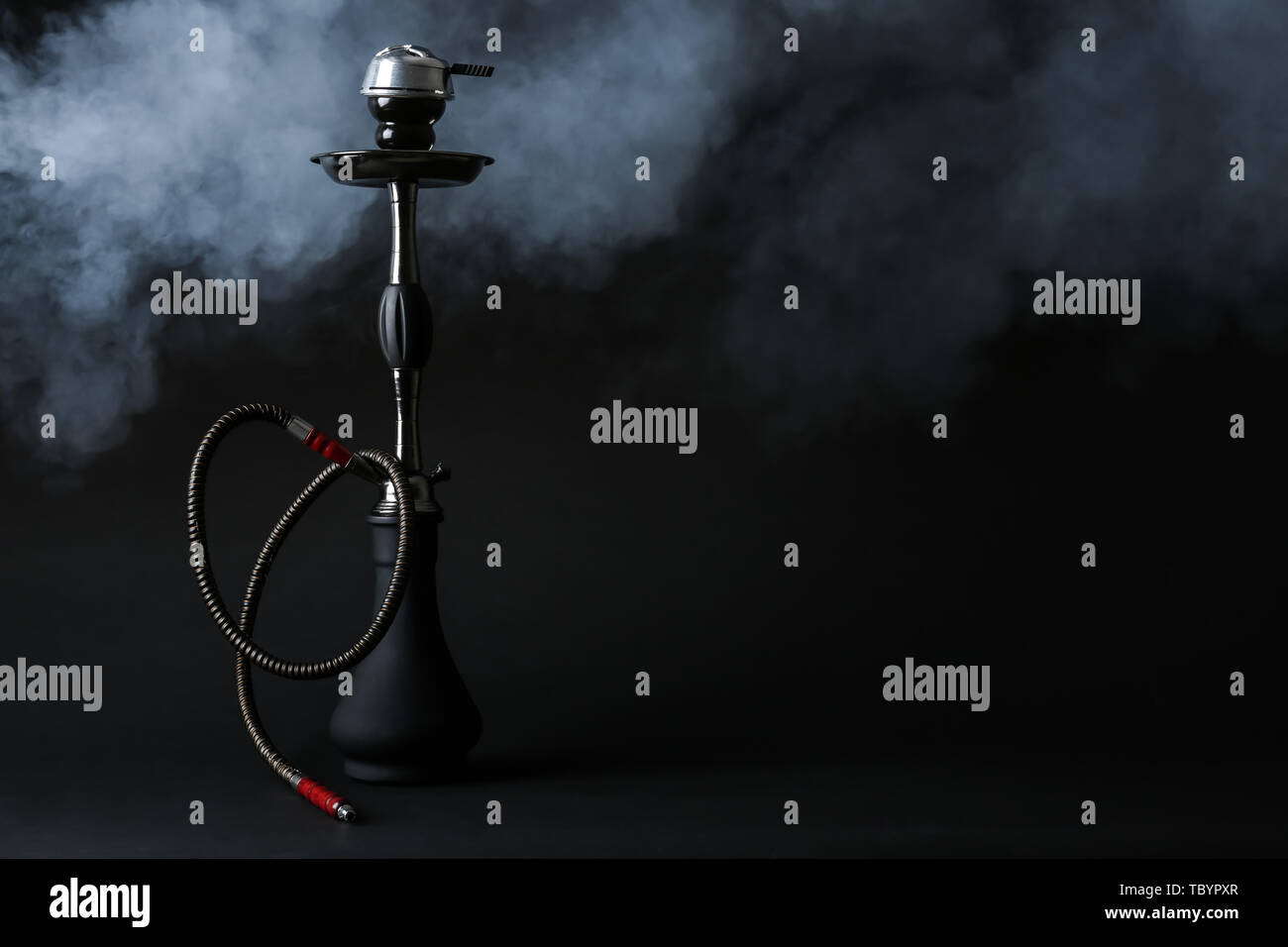 Hookah with fume on dark background Stock Photo - Alamy