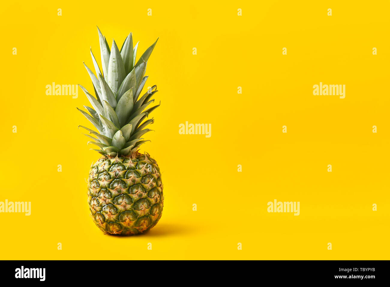 Ripe pineapple on color background Stock Photo - Alamy
