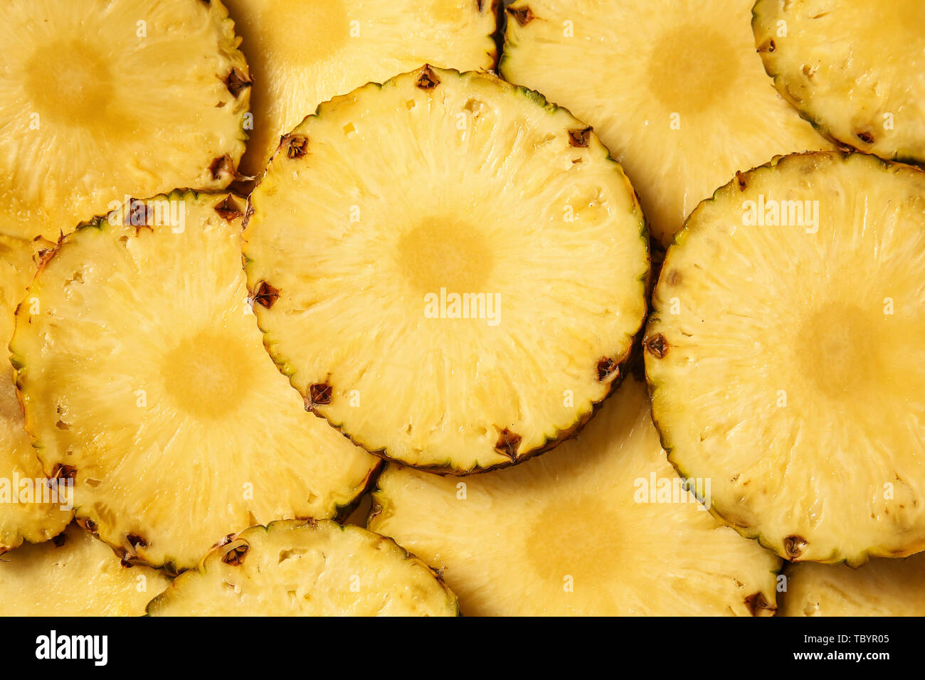 Many pineapple circles as background Stock Photo - Alamy