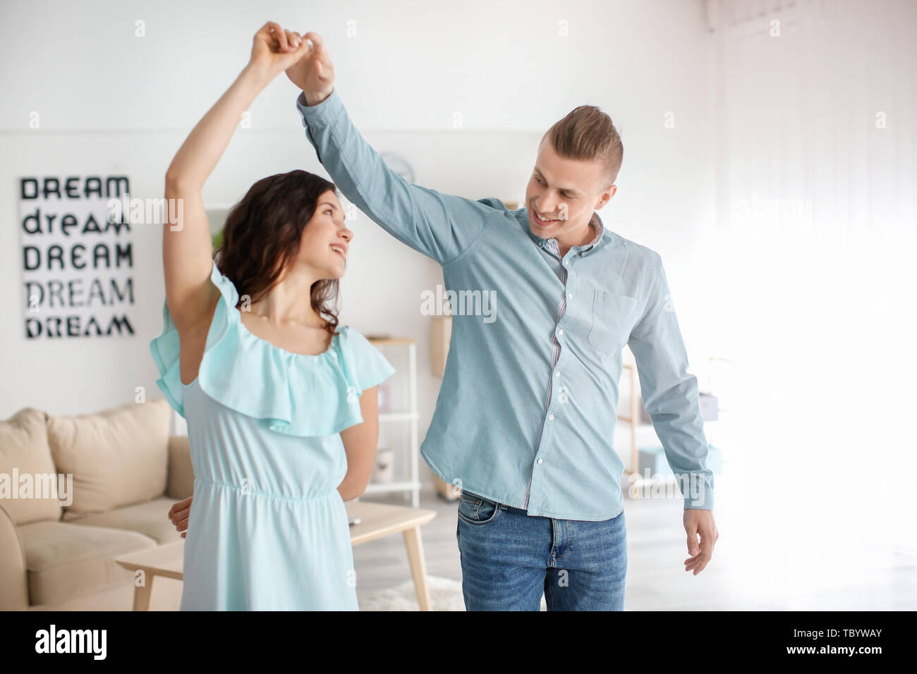 Adorable loving couple dancing at home Stock Photo - Alamy