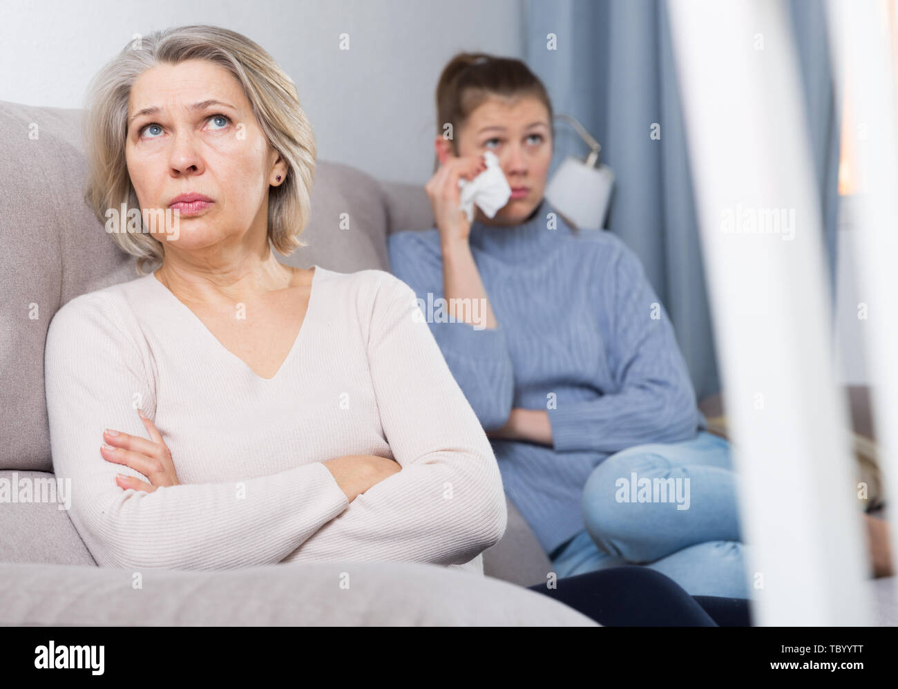 Silent resentment between mom and adult daughter Stock Photo - Alamy