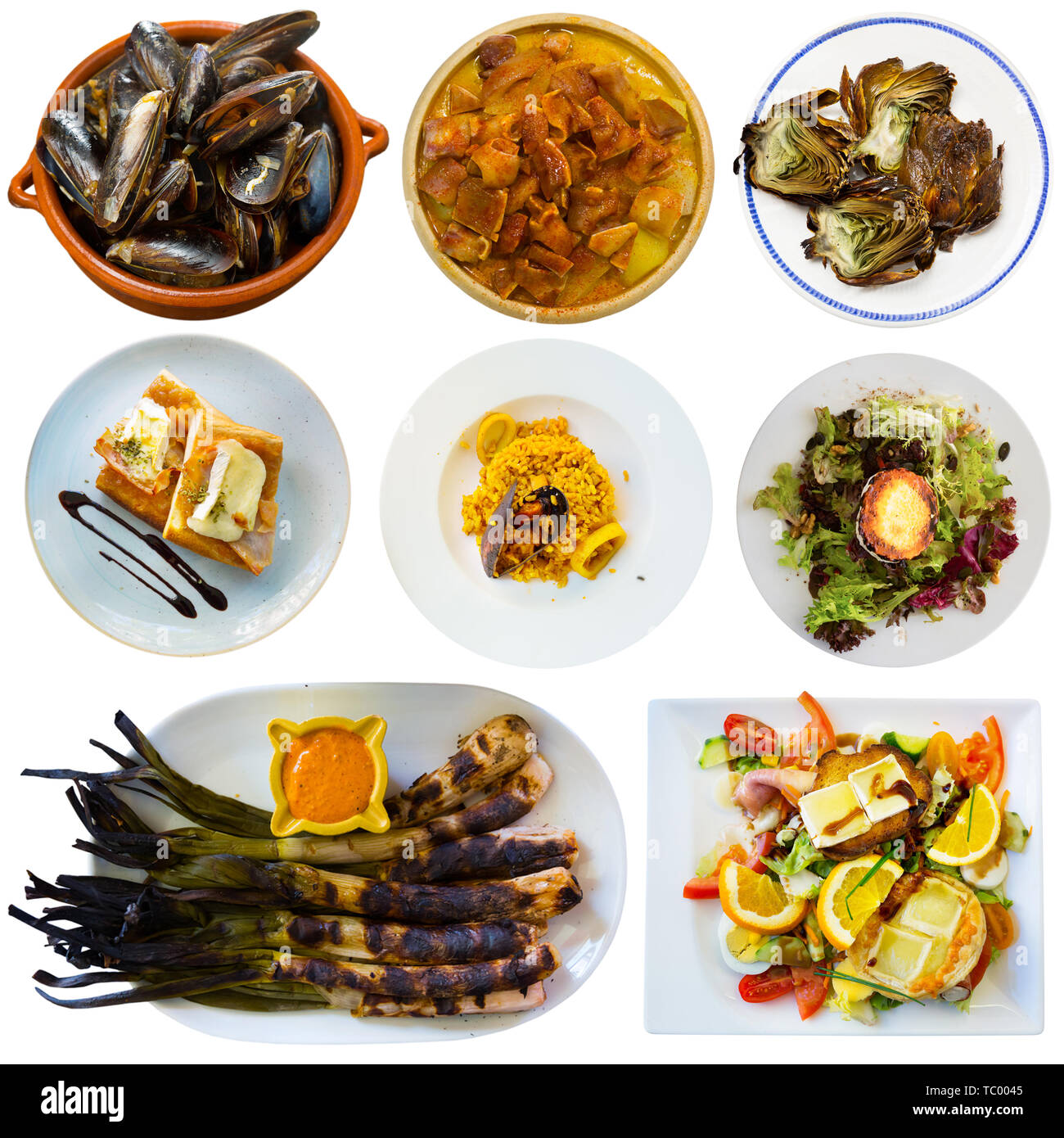 Set of various traditional Catalan dishes isolated on white background ...