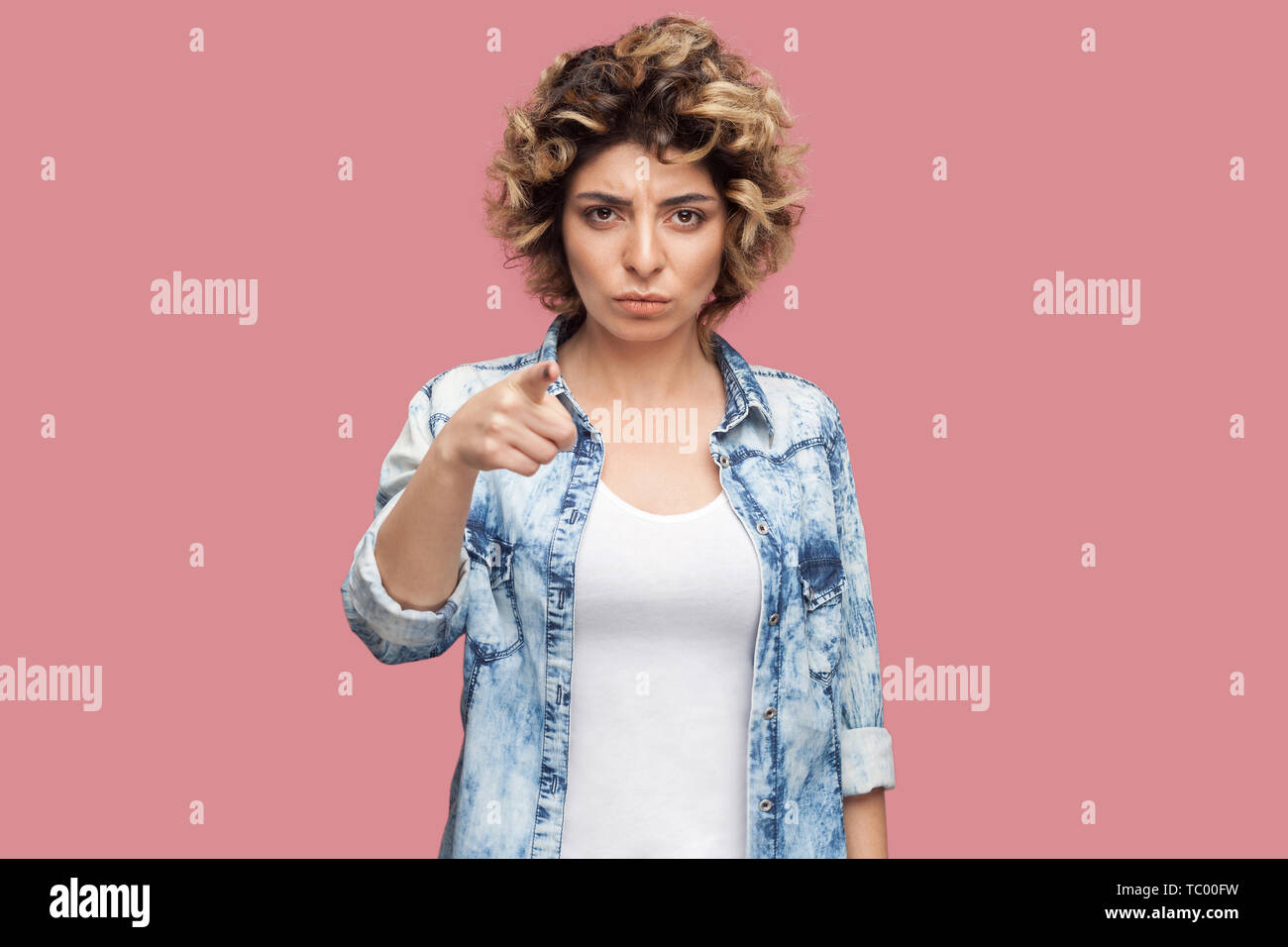 Angry young woman pointing scolding hi-res stock photography and images ...