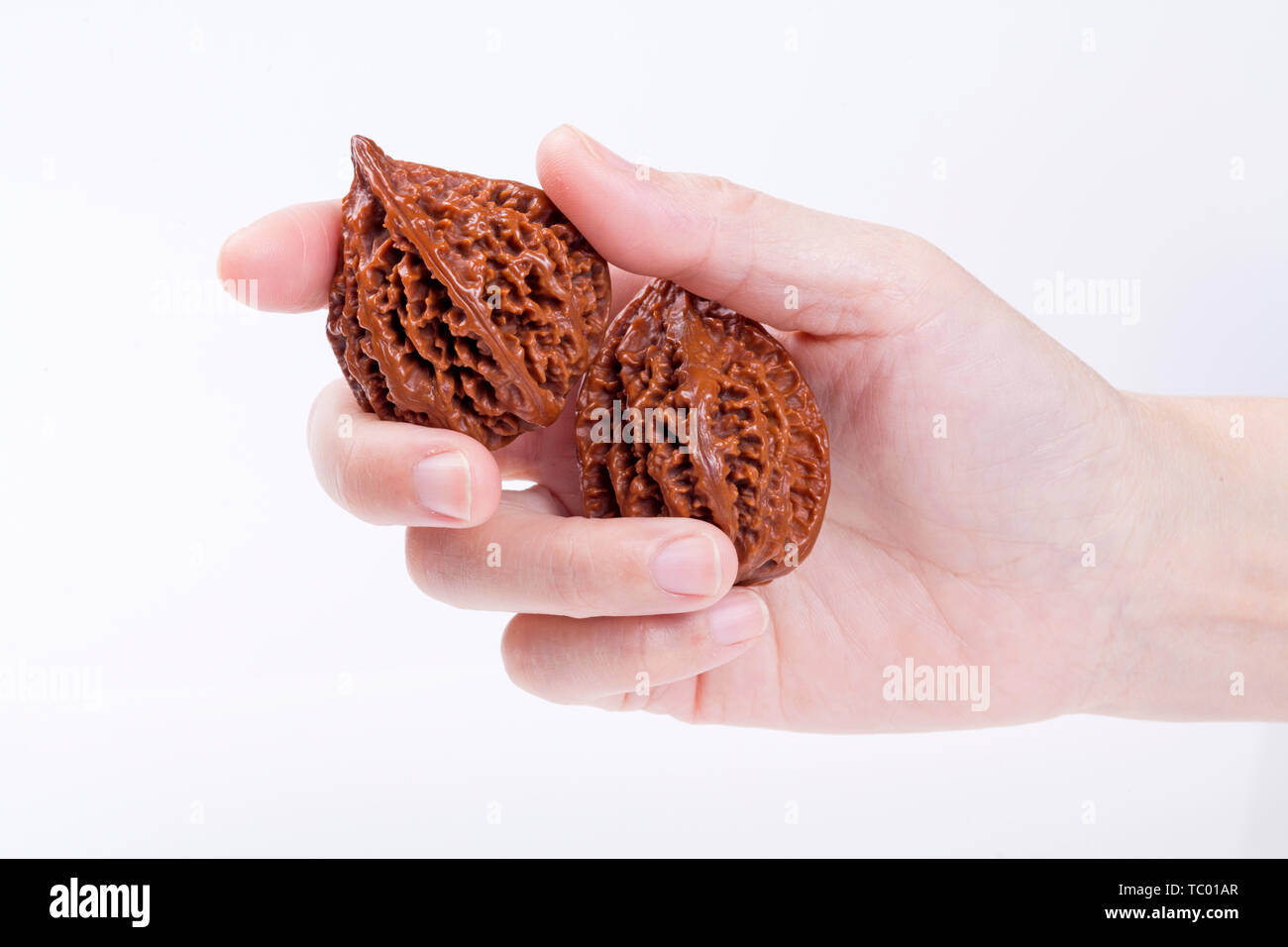 Hand dish walnuts Stock Photo - Alamy