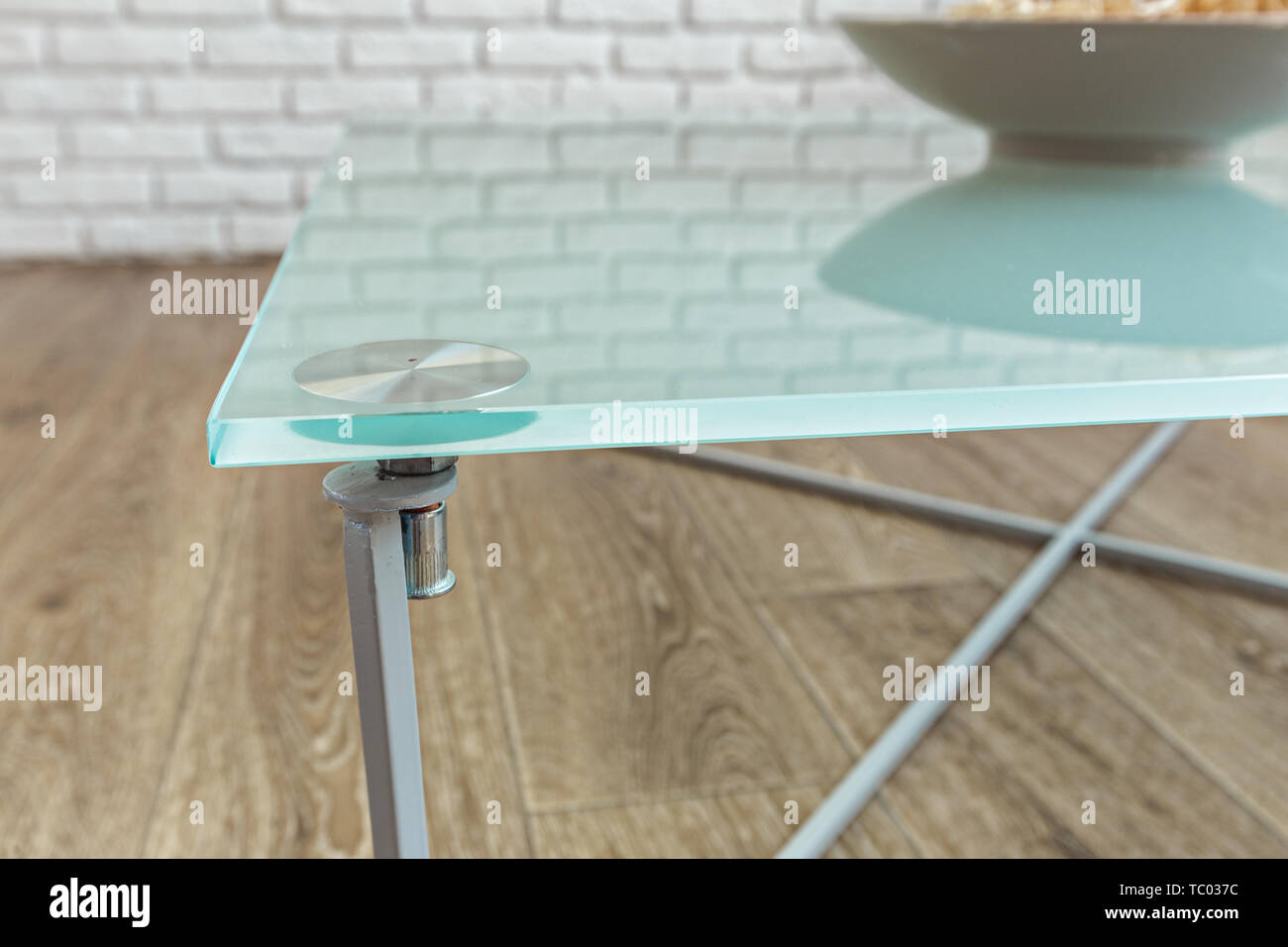 modern glass table in the loft interior Stock Photo - Alamy