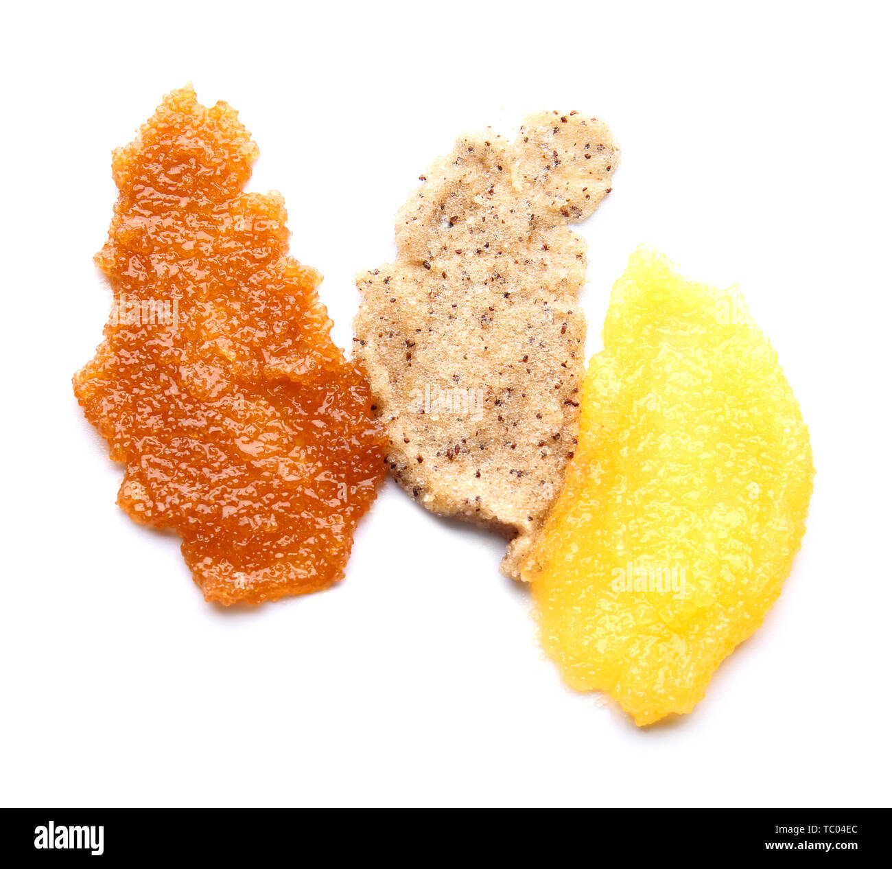 Samples of body scrub on white background Stock Photo - Alamy