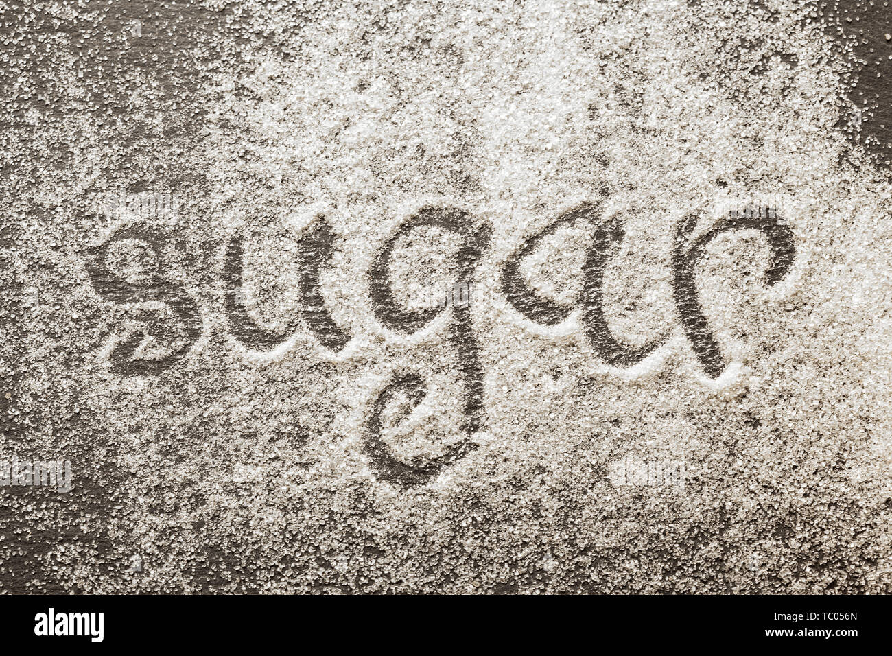 The word sugar written into a pile of white granulated sugar Stock ...