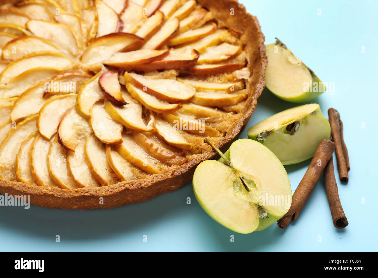 Tasty apple pie on color background Stock Photo - Alamy