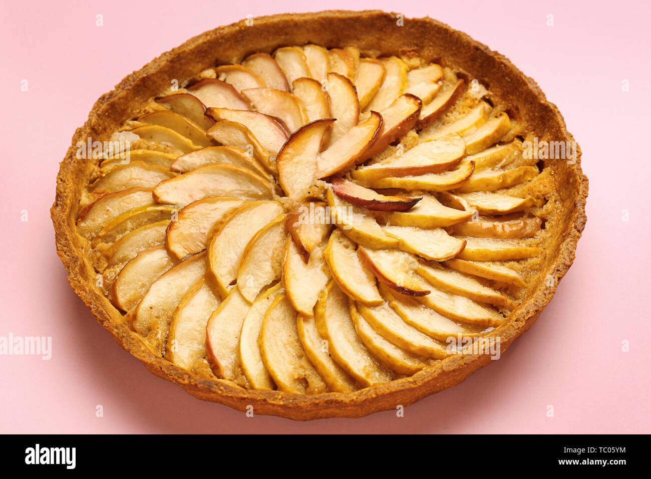 Tasty apple pie on color background Stock Photo - Alamy