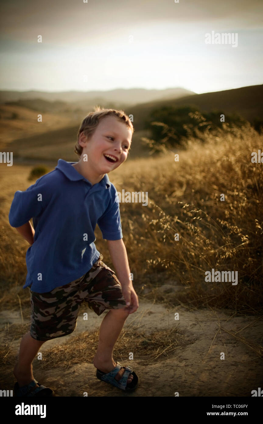 Portrait of a cheerful boy taking a walk Stock Photo - Alamy