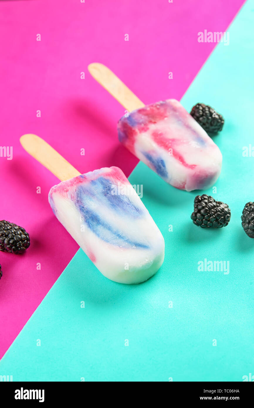 Tasty berry ice cream on color background Stock Photo - Alamy
