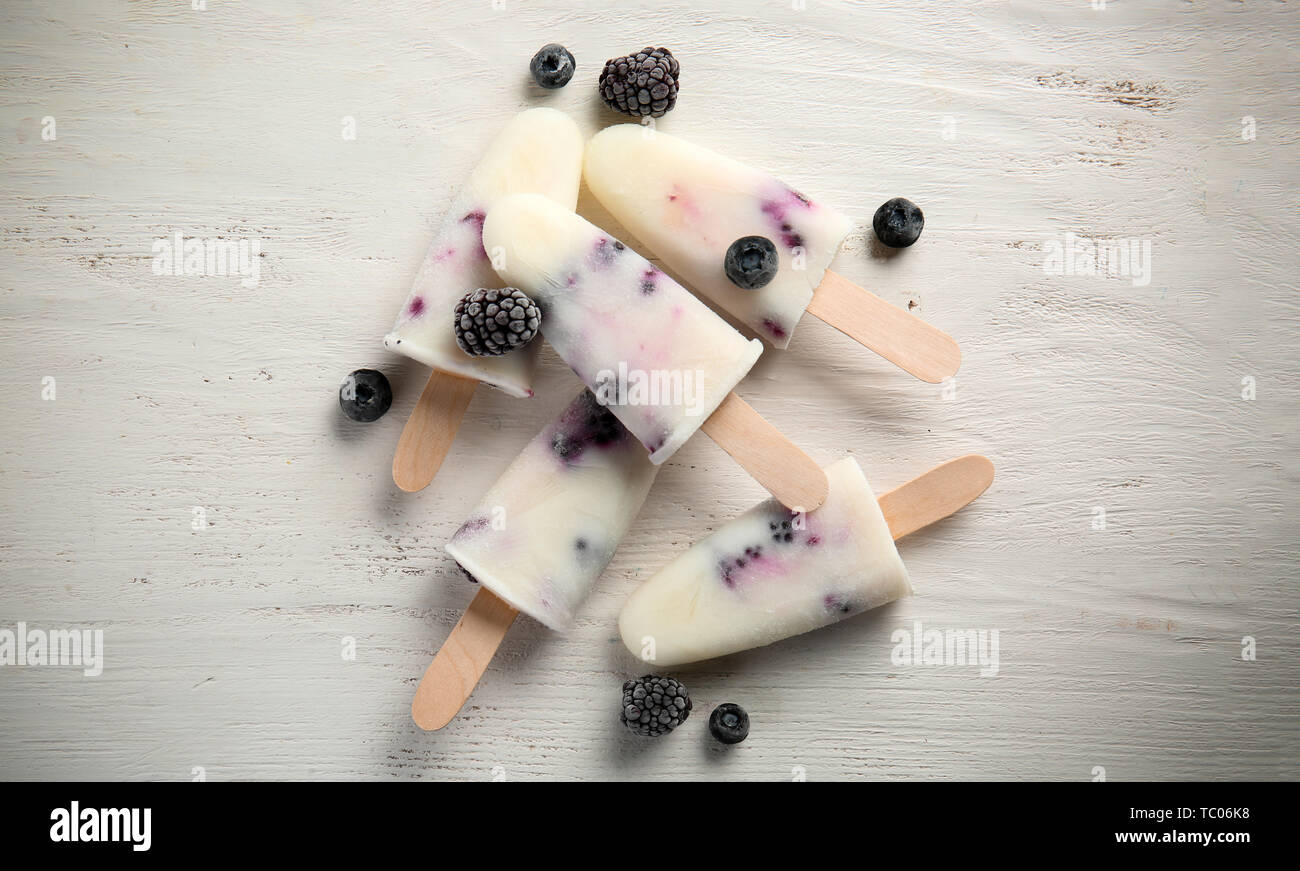 Tasty berry ice cream on white background Stock Photo - Alamy