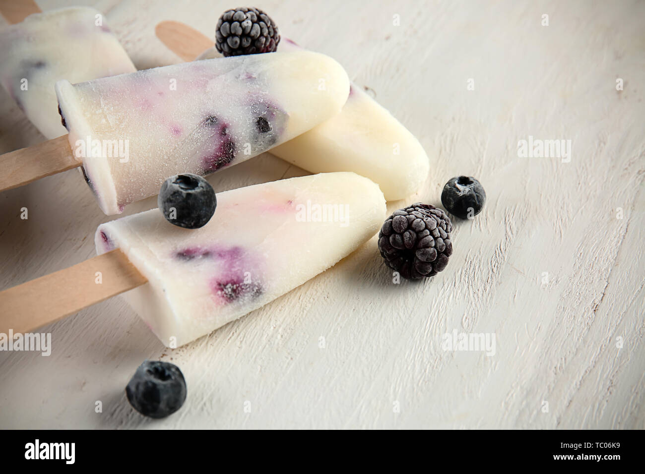 Tasty berry ice cream on white background Stock Photo - Alamy