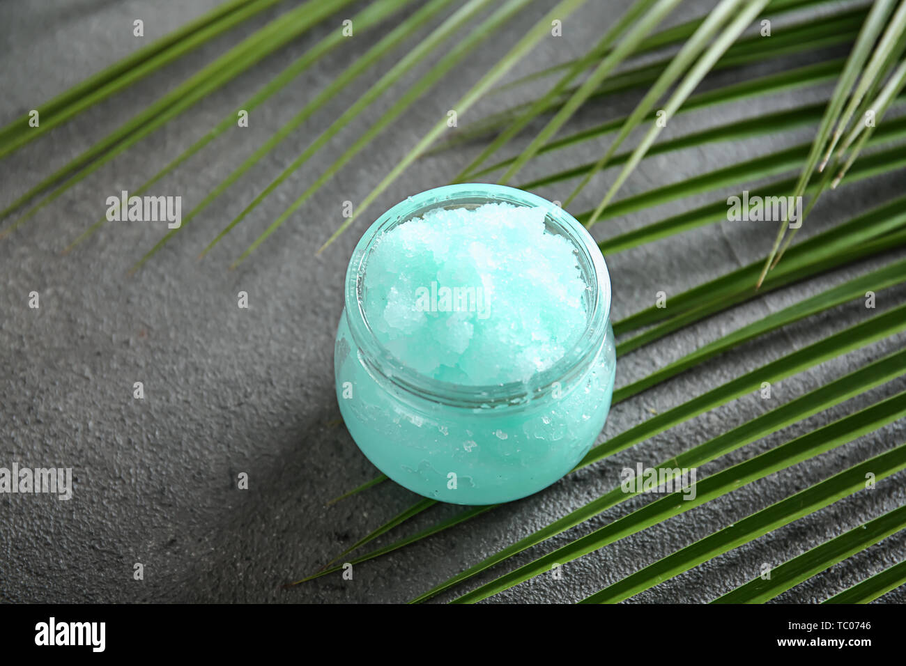 Jar with body scrub on table Stock Photo - Alamy