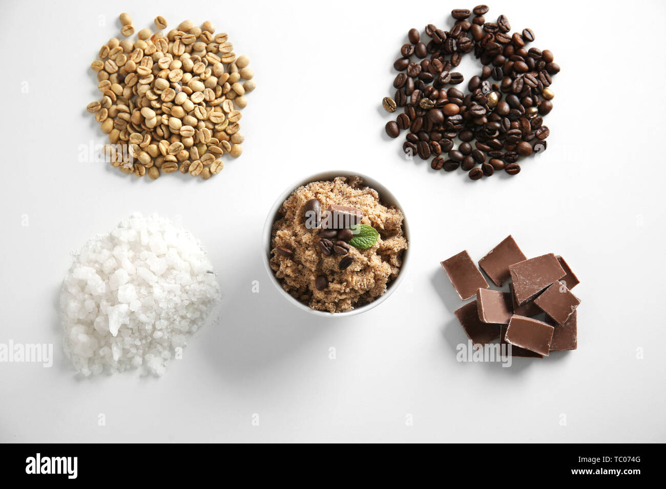 Bowl with body scrub and ingredients on white background Stock Photo ...