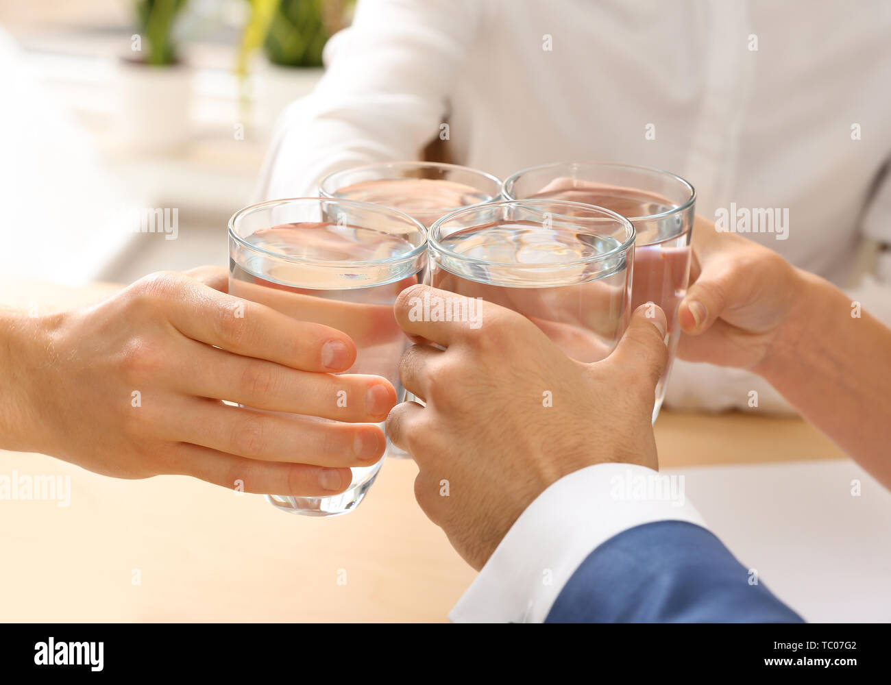 People drinking water in office, closeup Stock Photo - Alamy