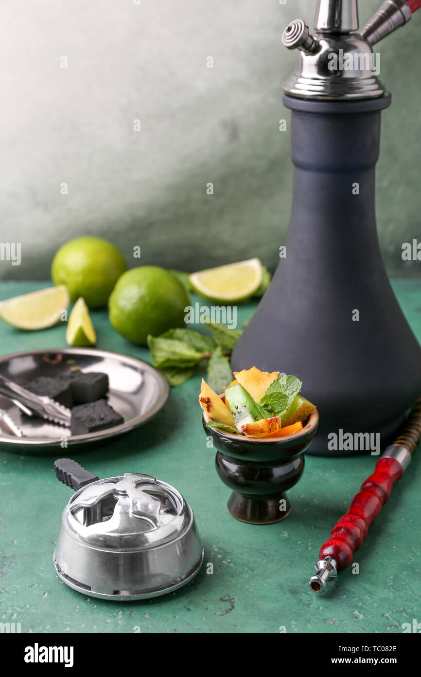 Hookah and fresh fruits on color table Stock Photo - Alamy