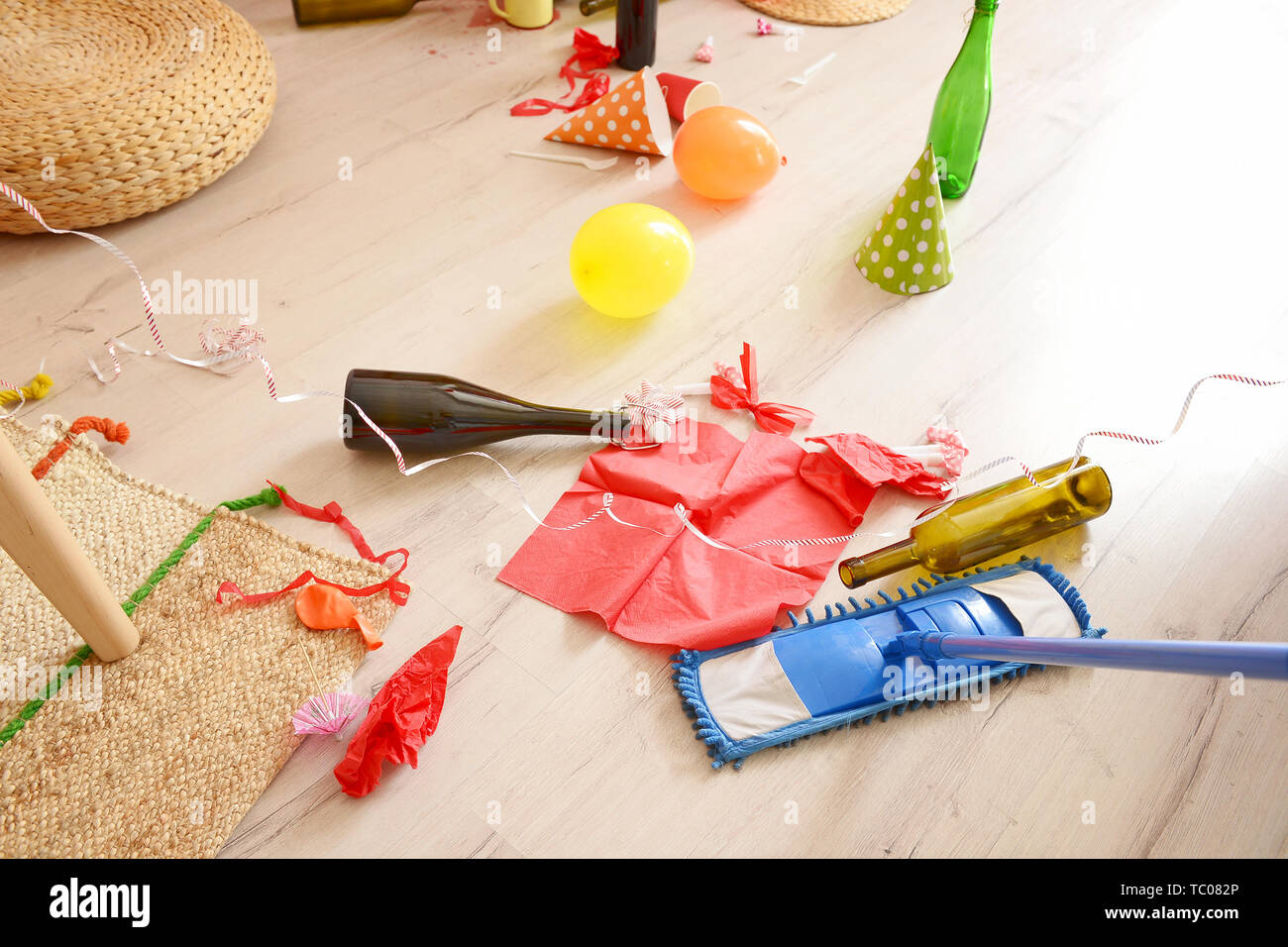 Cleaning of room in terrible mess after party Stock Photo - Alamy