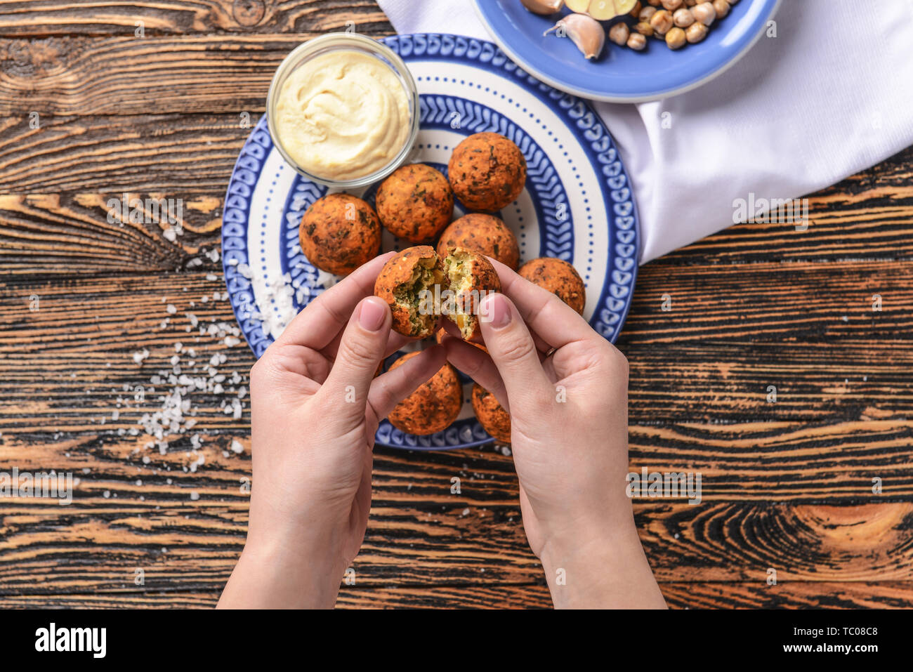 Woman eating falafel hi-res stock photography and images - Alamy
