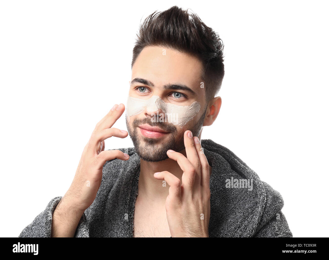 Handsome man with clay mask on his face against white background Stock ...