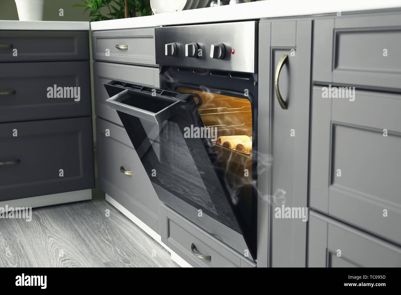 Open oven with tasty homemade pastry in kitchen Stock Photo - Alamy