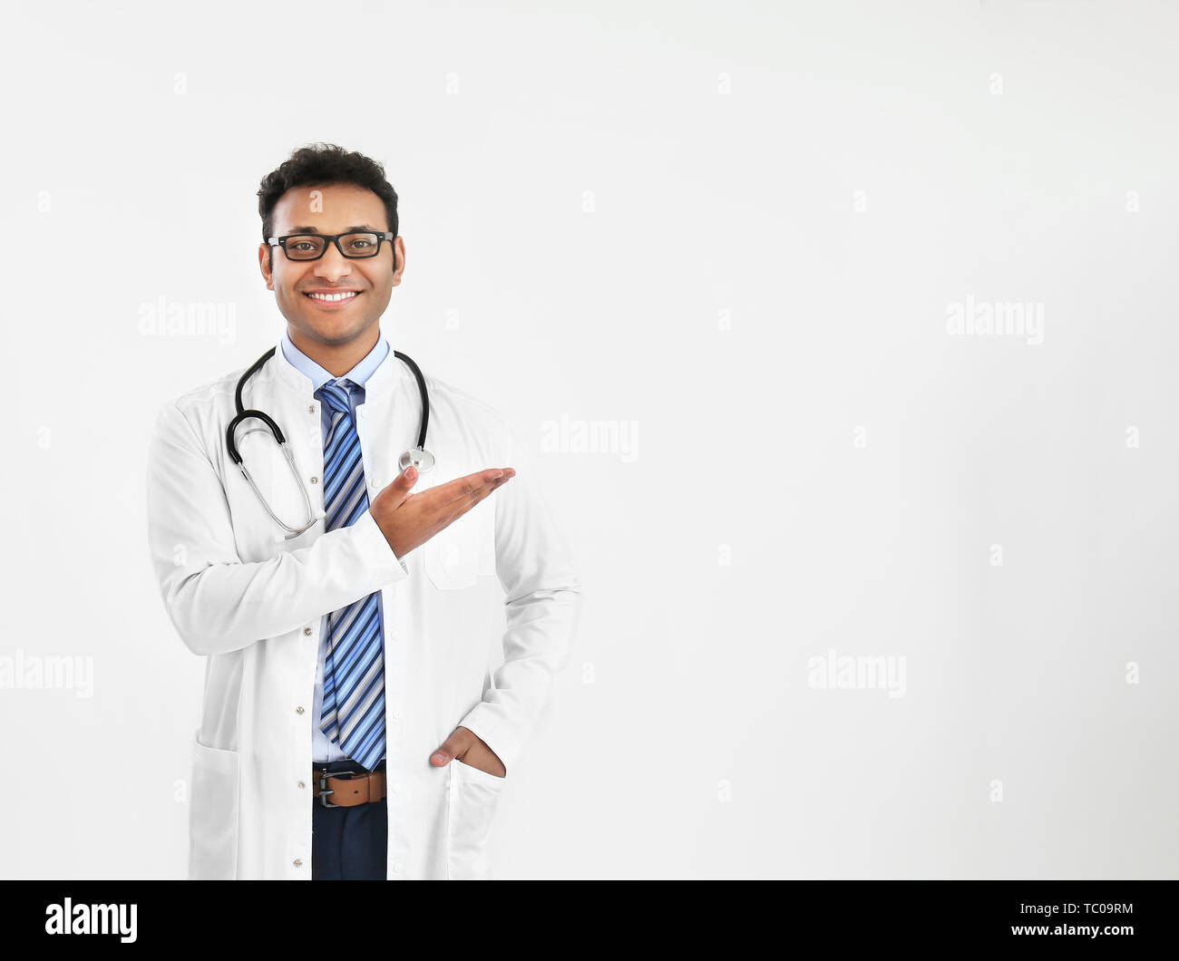Handsome man doctor showing something hi-res stock photography and ...