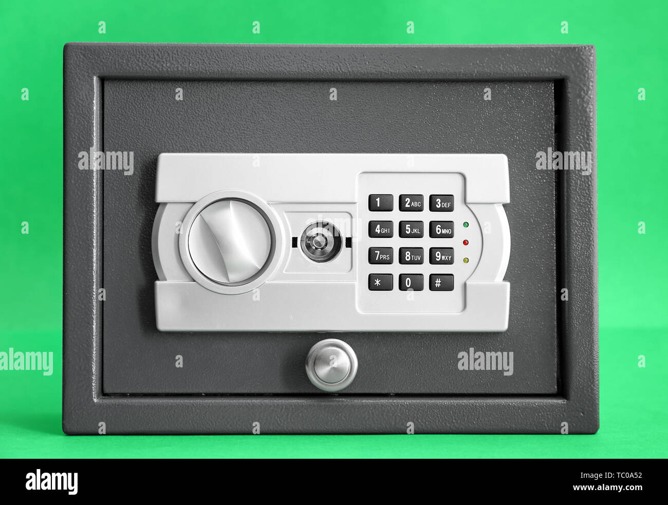 Modern safe on color background Stock Photo - Alamy