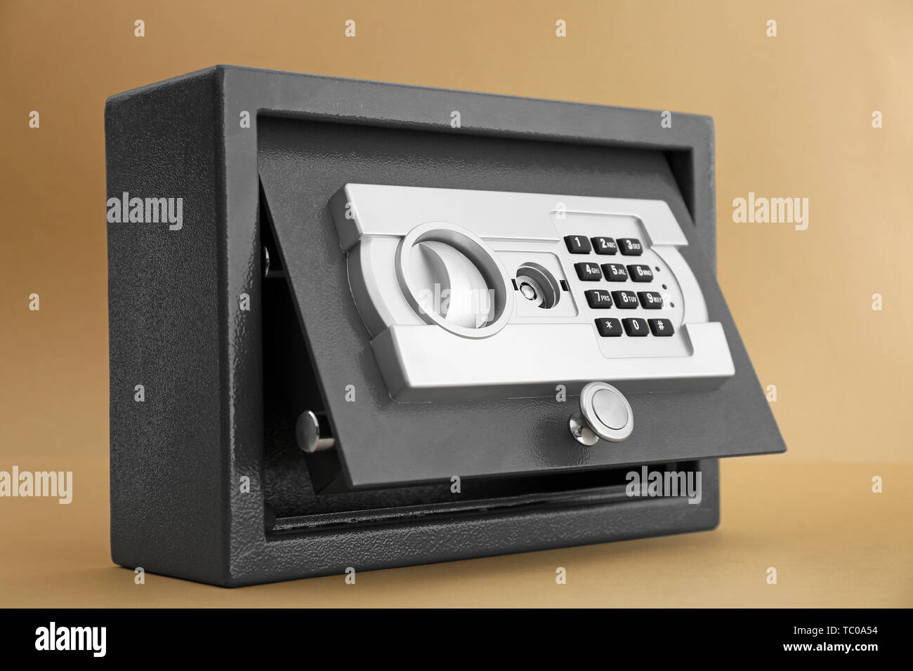 Modern safe on color background Stock Photo - Alamy