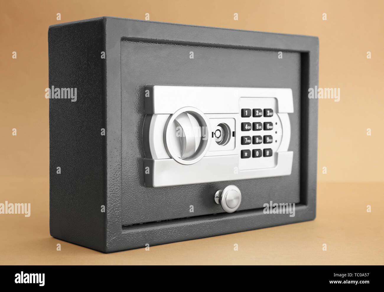 Modern safe on color background Stock Photo - Alamy