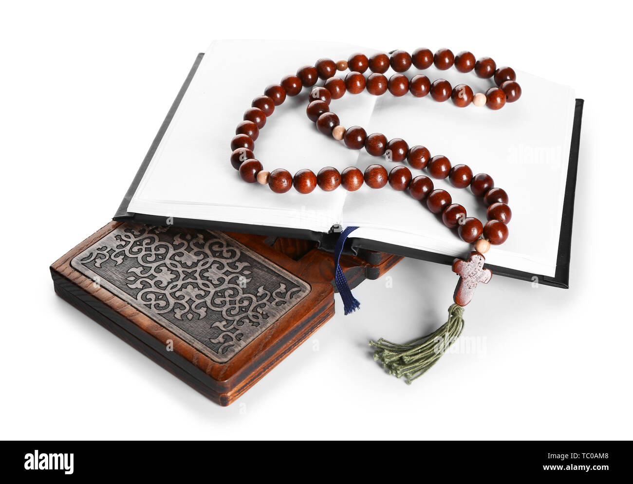 Muslim beads, rehal and Koran on white background Stock Photo - Alamy