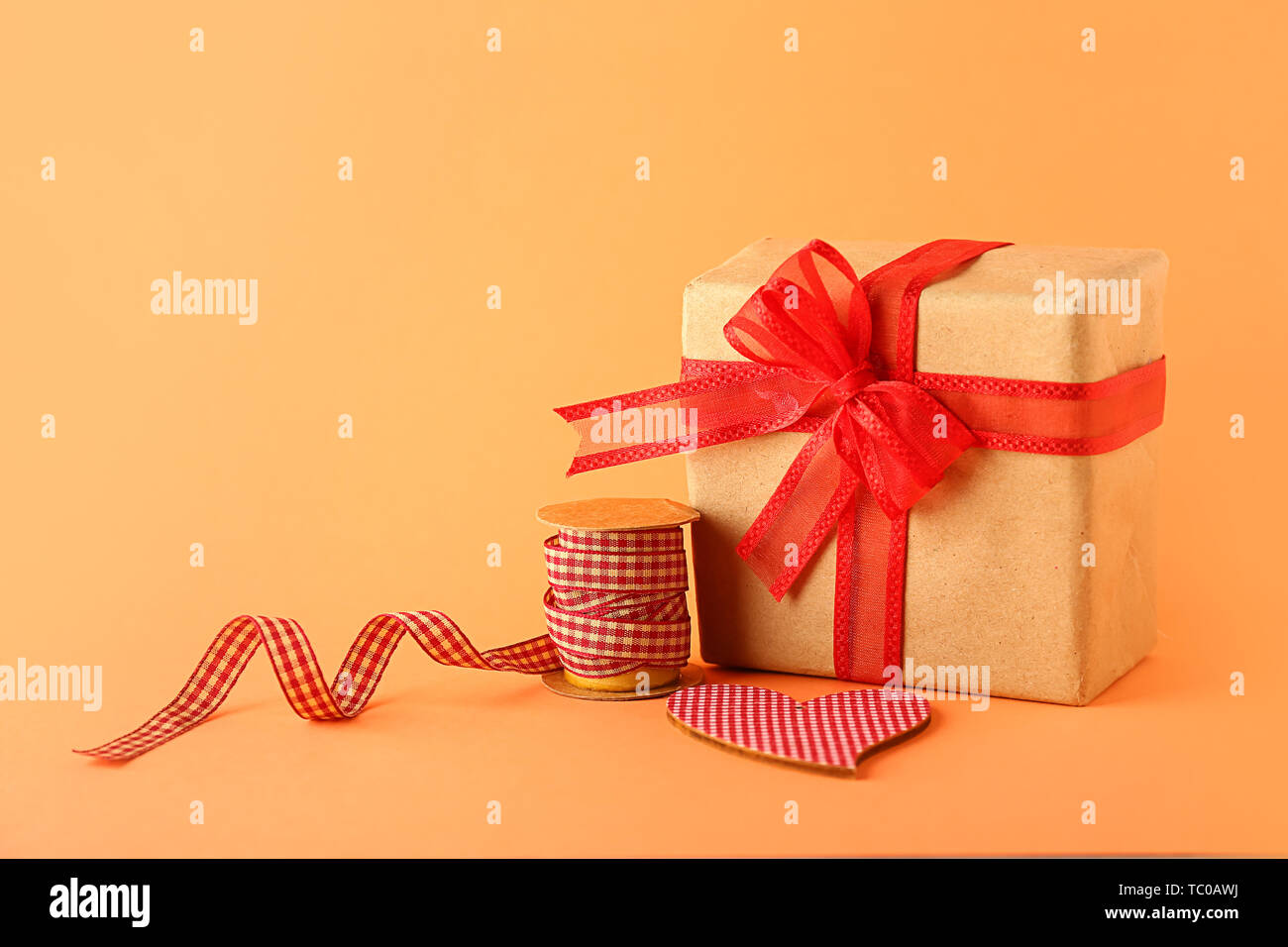 Beautiful gift box and decor on color background Stock Photo - Alamy
