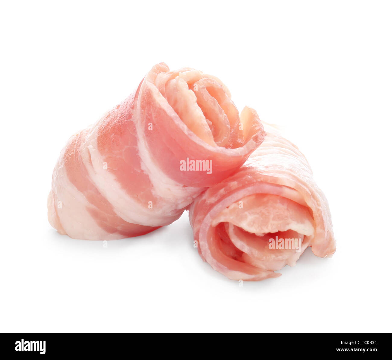 Raw bacon rolls on white background Stock Photo - Alamy