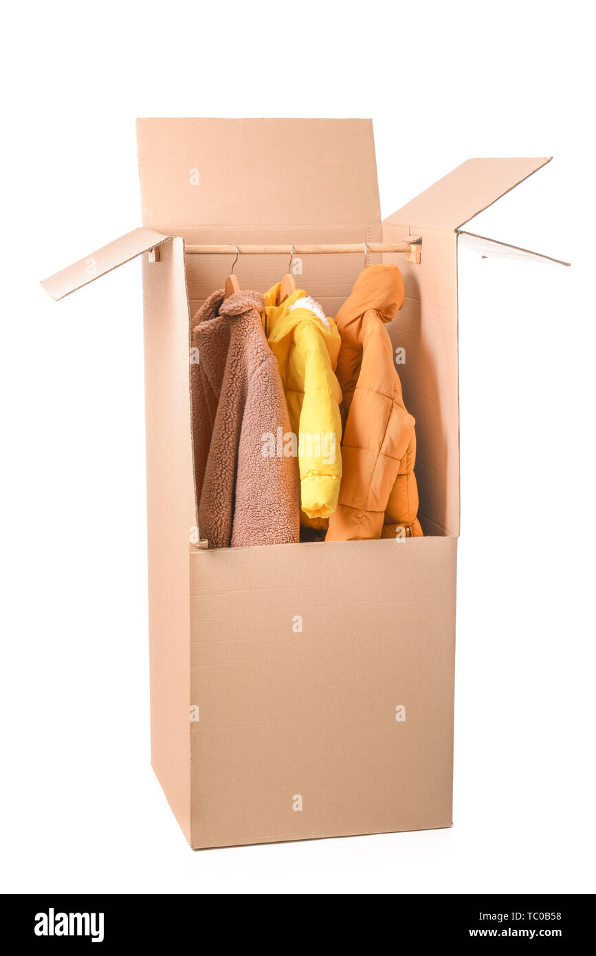 Wardrobe box with clothes on white background Stock Photo - Alamy