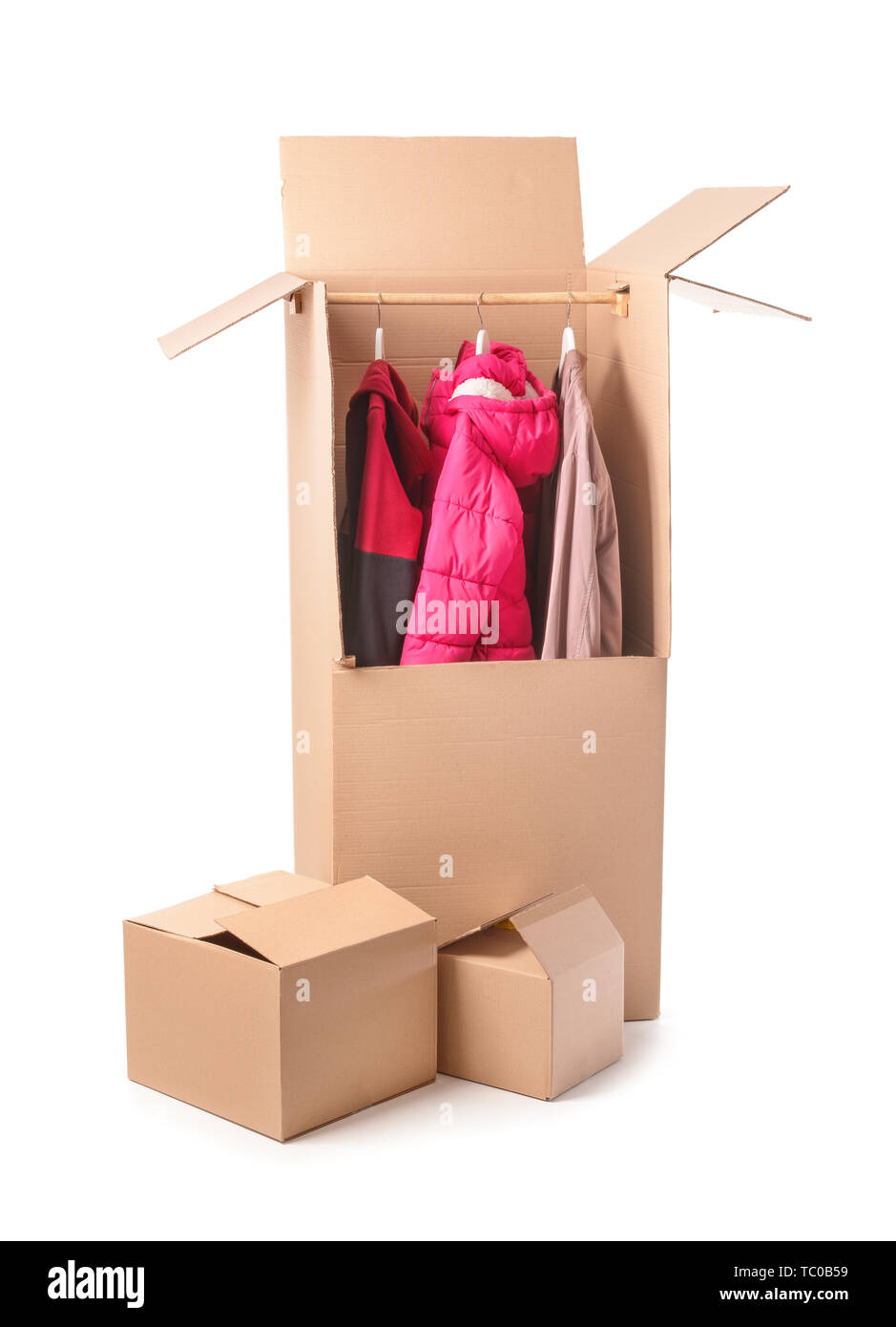 Wardrobe boxes with clothes on white background Stock Photo - Alamy