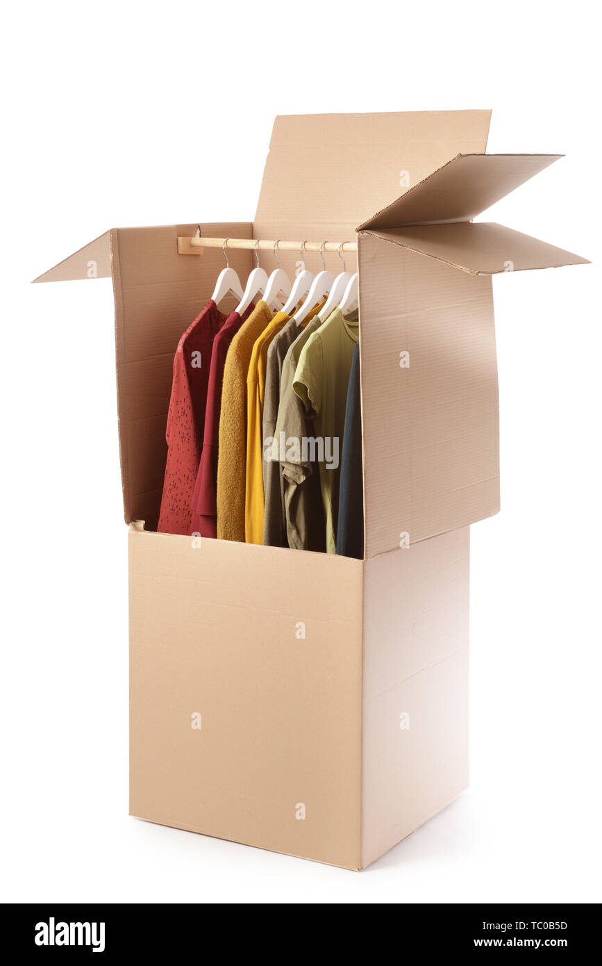 Wardrobe box with clothes on white background Stock Photo - Alamy